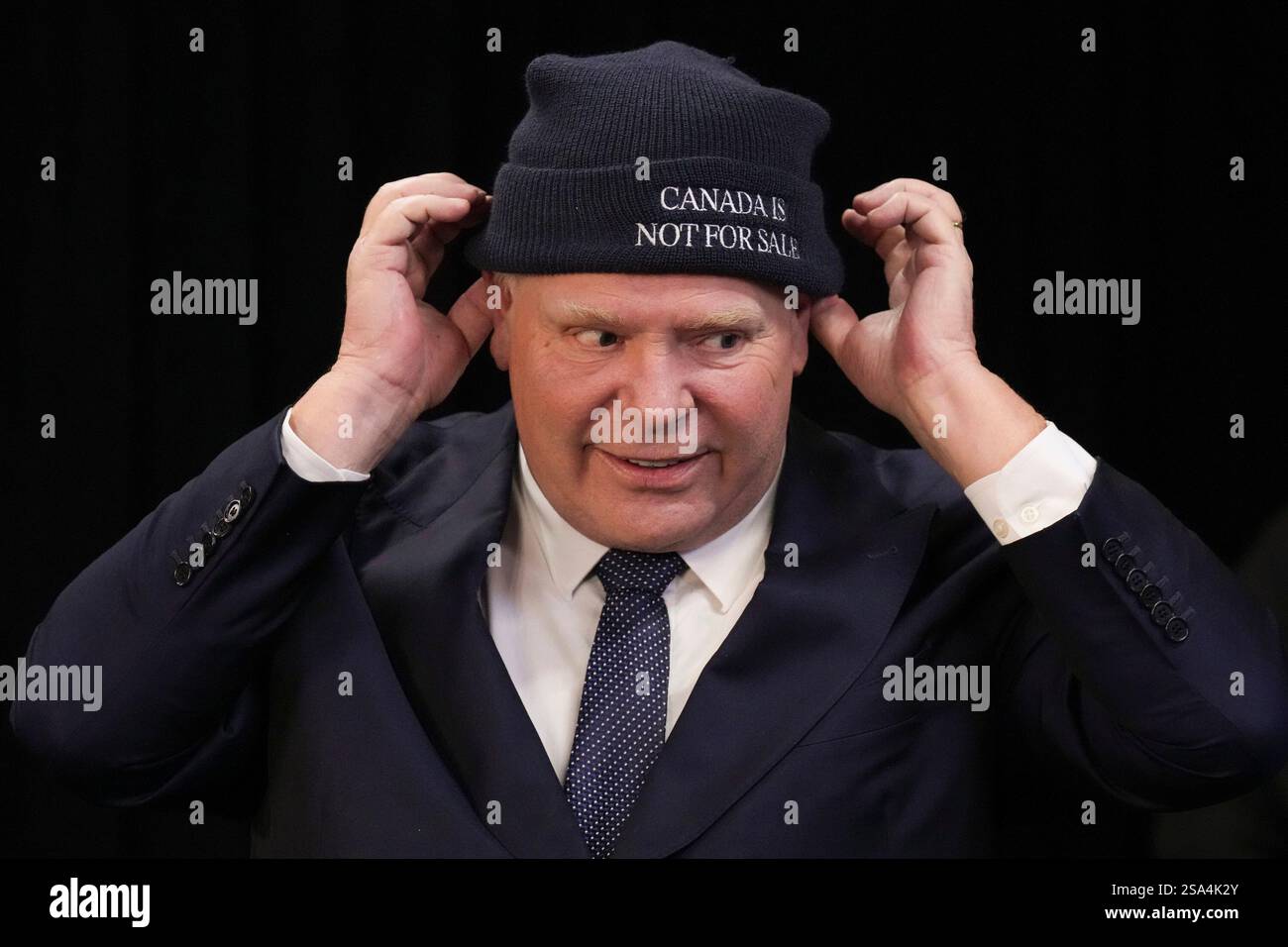 FILE - Ontario Premier Doug Ford dons a toque following a press ...