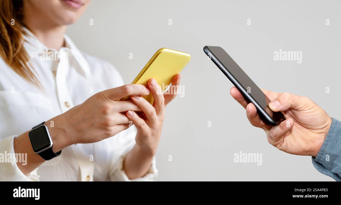 Digital transformation and data exchange. Mobile phones in hands Stock ...