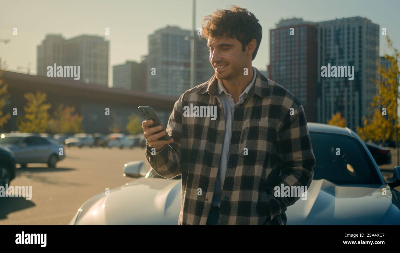 Caucasian man user driver using smartphone mobile phone messaging ...