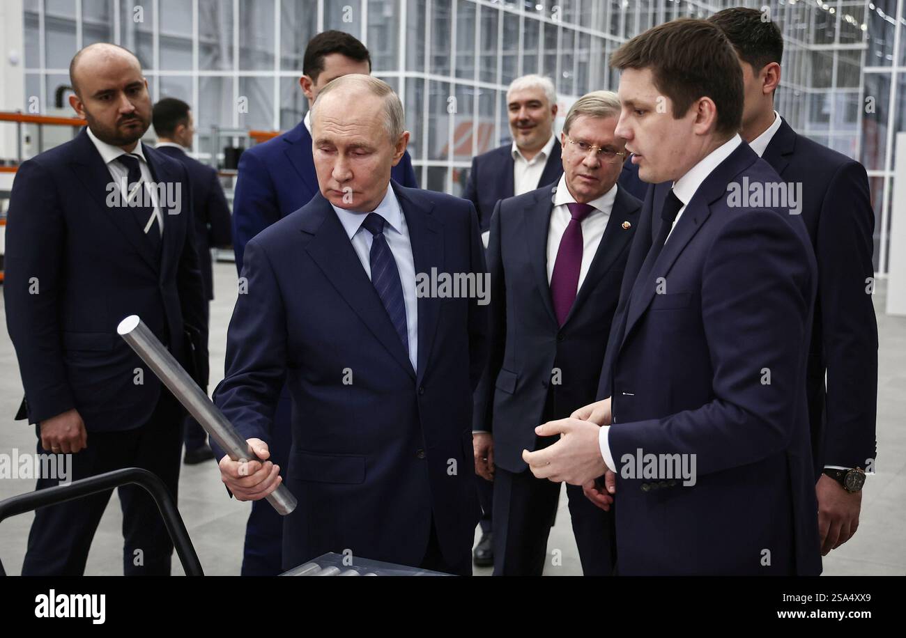 Russian President Vladimir Putin, accompanied by Deputy Prime Minister Vitaly Saveliev, Industry ...