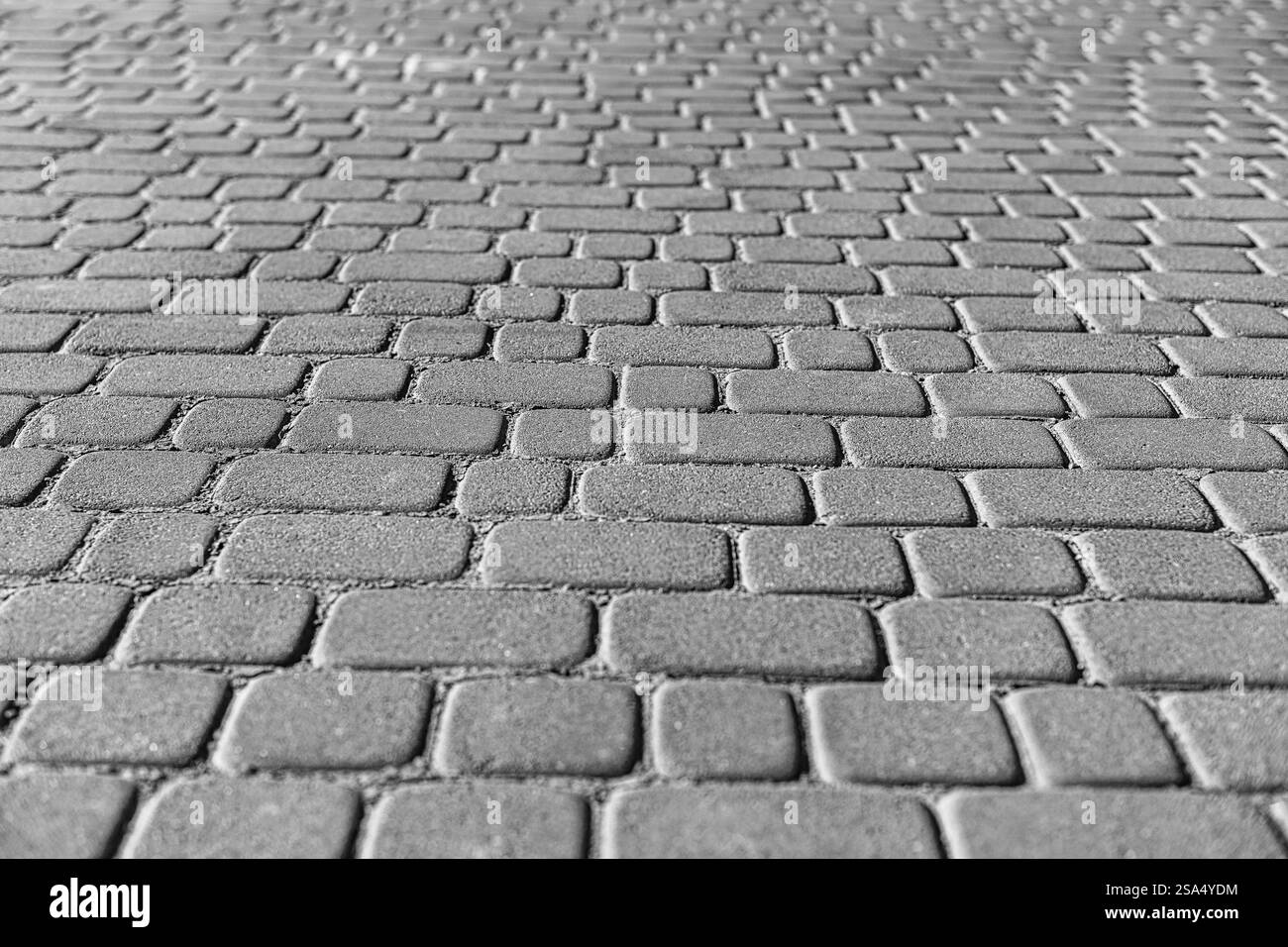 Concrete road paving stones background Stock Photo - Alamy
