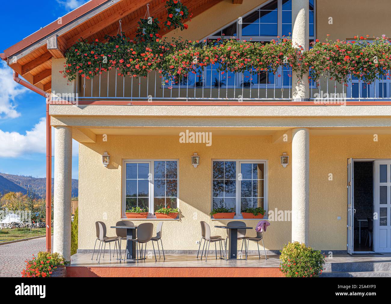 A charming countryside house with a cozy outdoor terrace Stock Photo ...