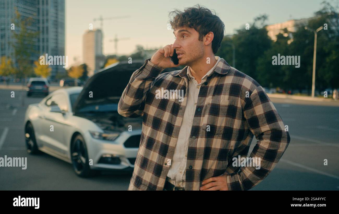 Worried stressed man driver Caucasian guy talk mobile phone calling car ...