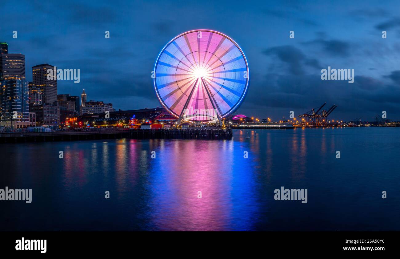 A stunning long exposure panorama of the Seattle Great Wheel glowing ...
