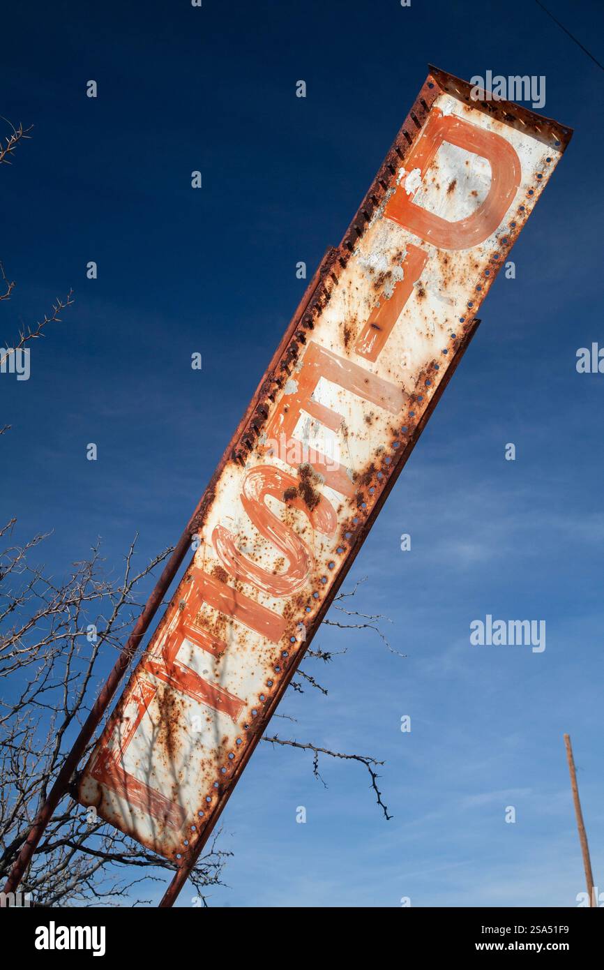 Rusty old vertical metal hand painted sign for diesel fuel mounted on a ...