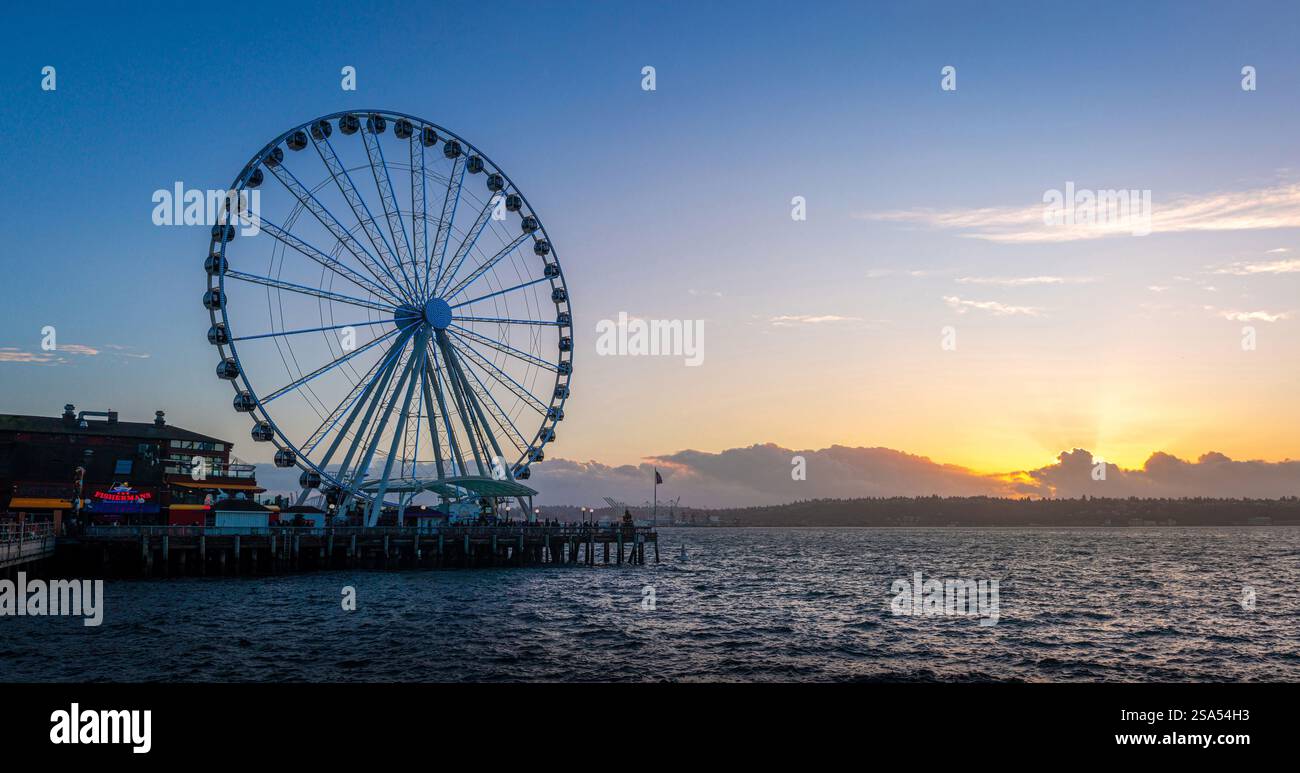 A vibrant sunset panorama featuring the Seattle Great Wheel on the ...