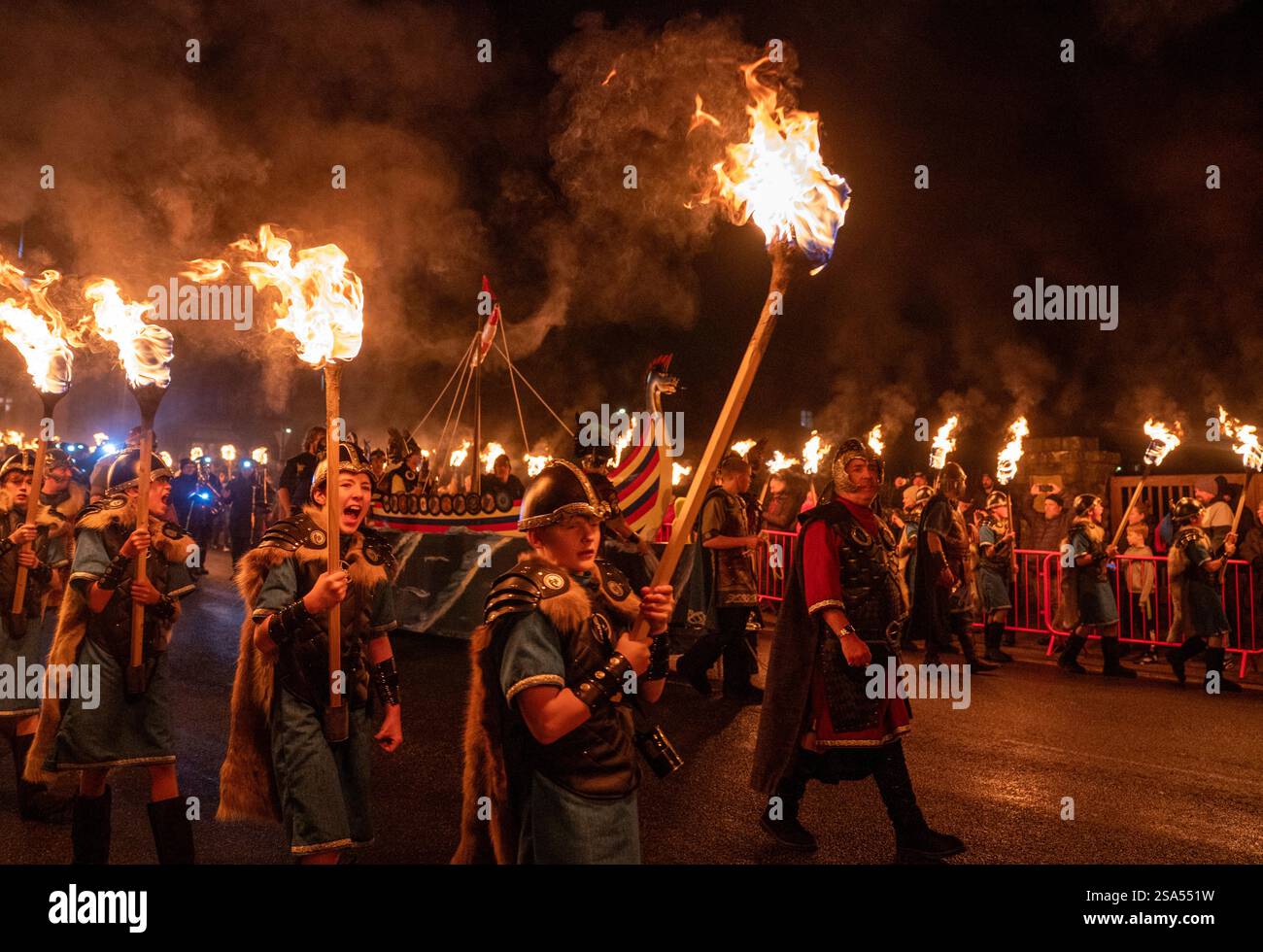 Youngsters take part in the torch procession in the Junior Up Helly Aa in Lerwick on the ...