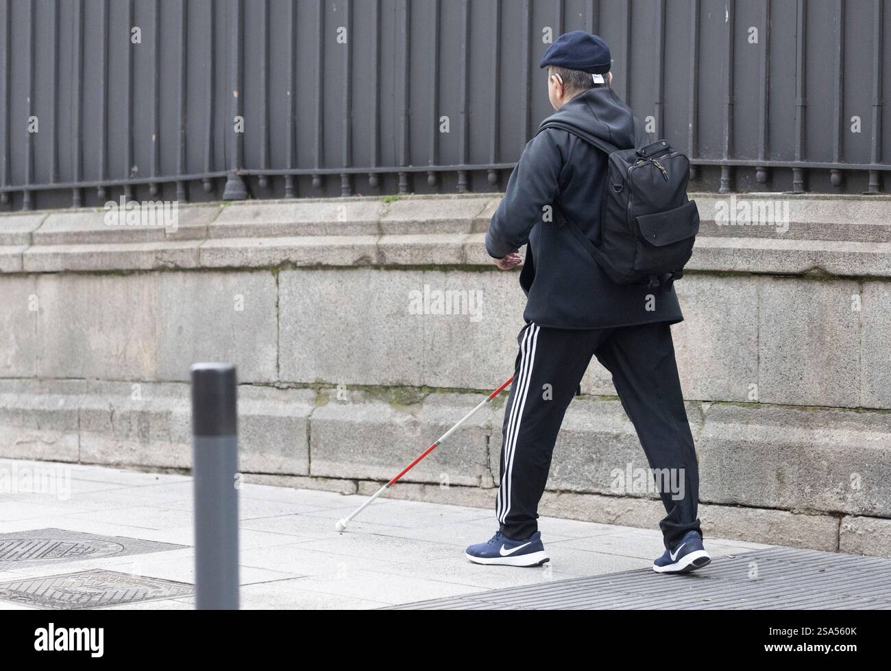 A visually impaired person walks on January 28, 2025, in Madrid (Spain ...