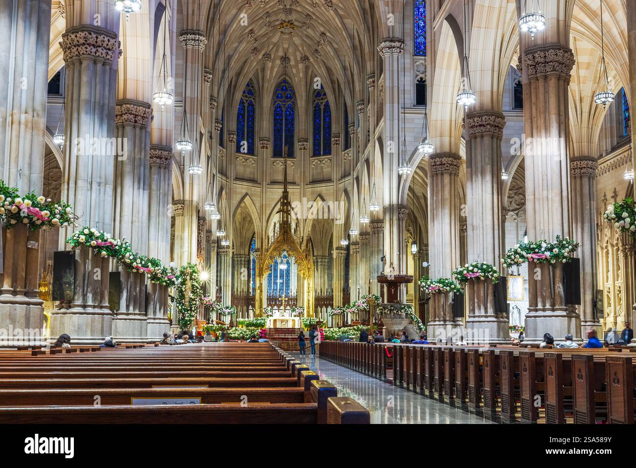 Ornate gothic cathedral interior with decorated altar and floral ...