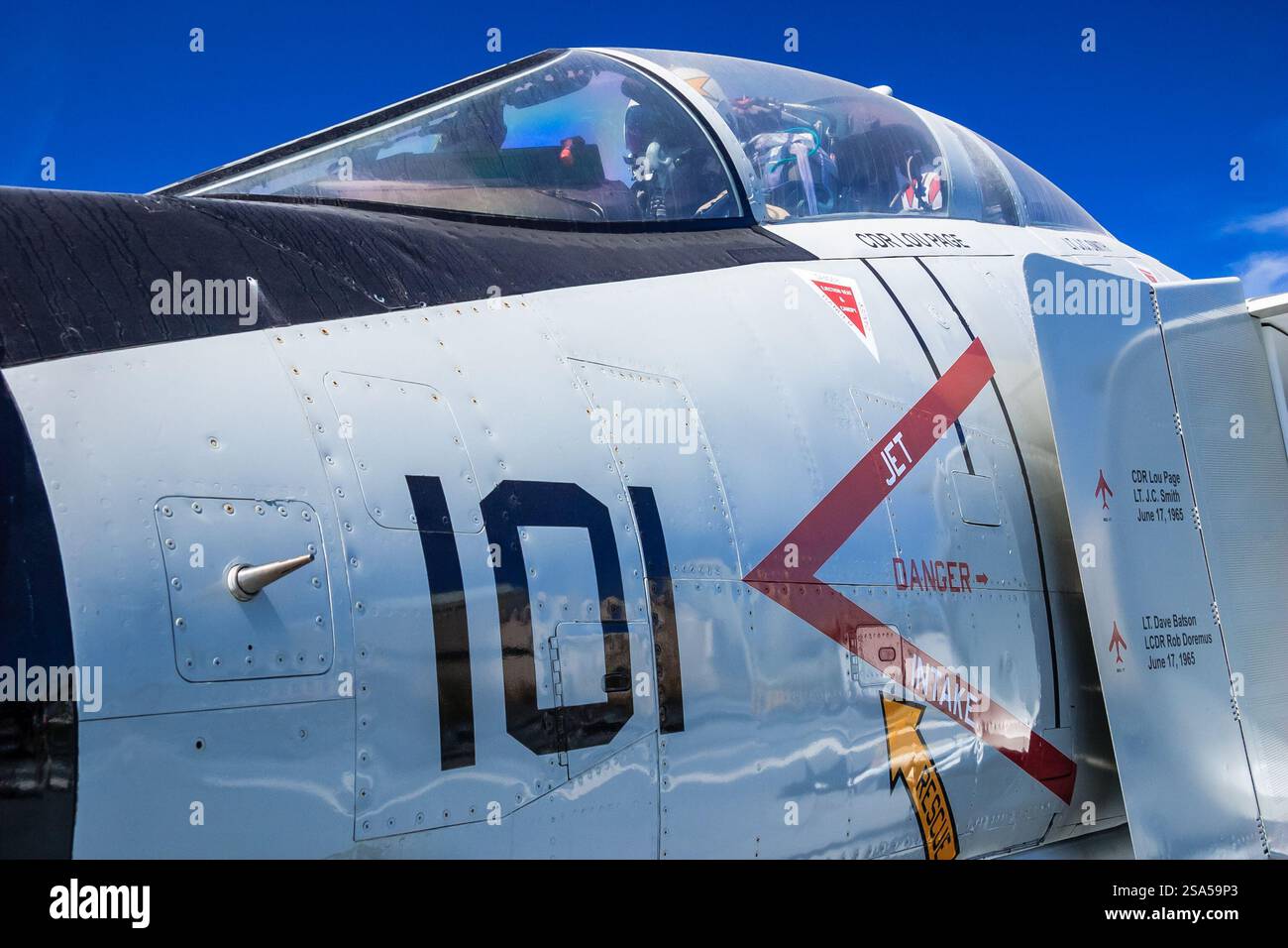 A fighter jet with the number 101 on the side. The plane is white and ...
