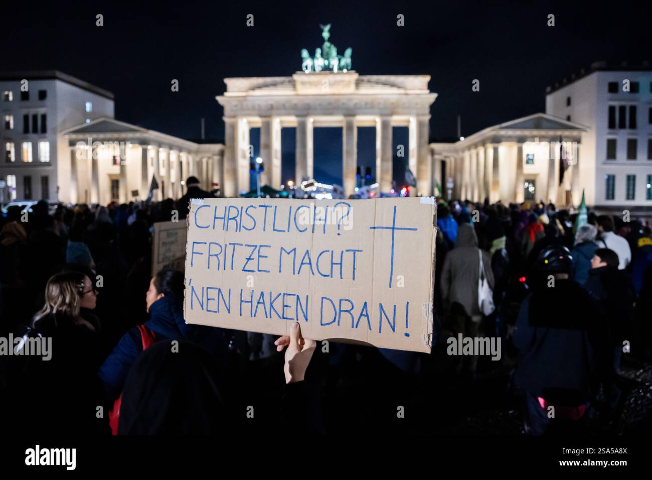 Berlin, Germany. 28th Jan, 2025. A poster is held up at a rally against ...