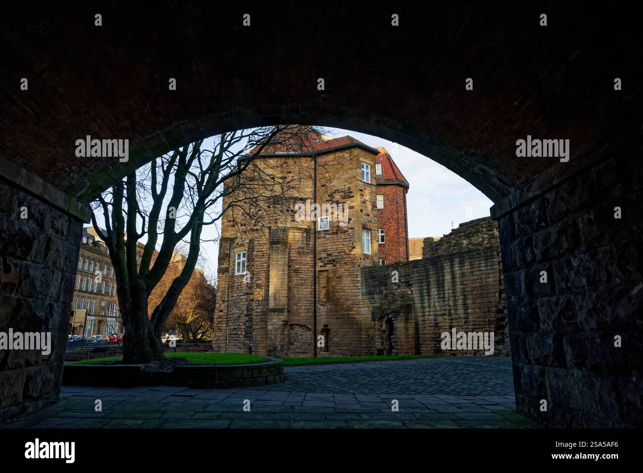 The Black Gate of Newcastle Castle framed by one of the arches of ...