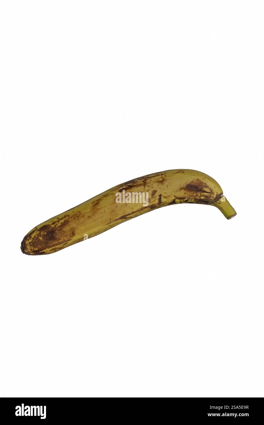 Lonely old banana with brown spots on the peel Stock Photo - Alamy