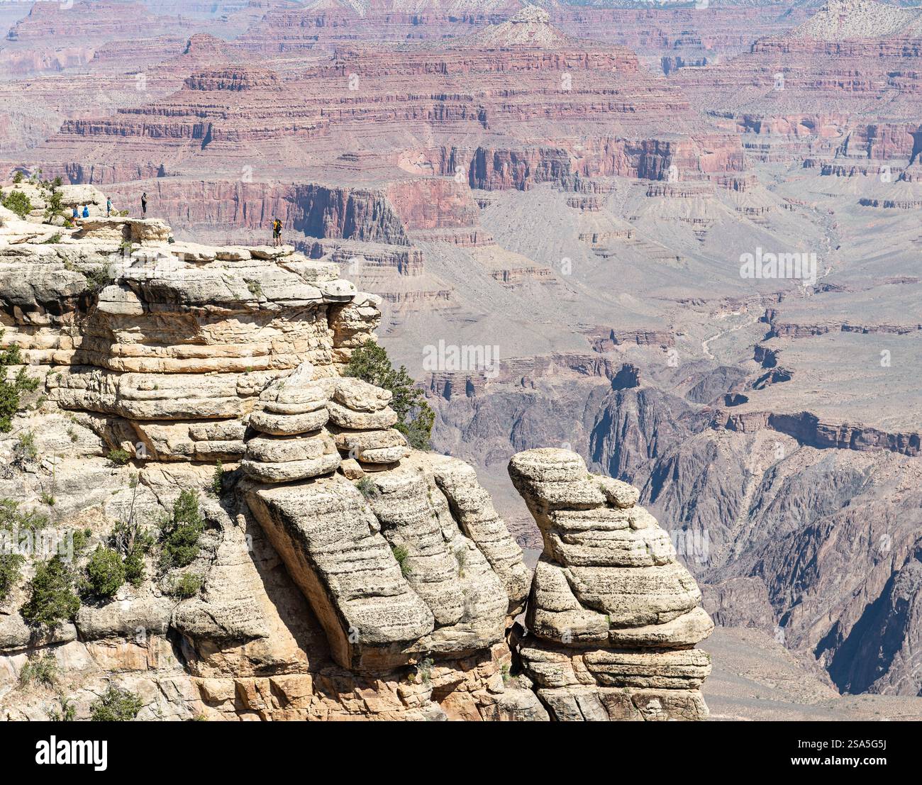 Selfie Photographers (unrecognizable) on the edge of a cliff at the ...