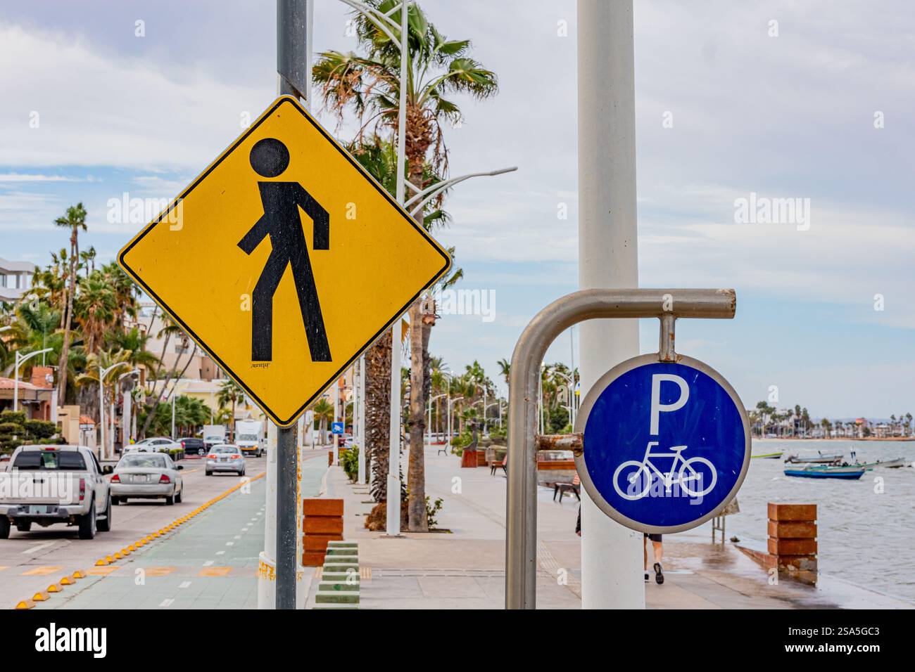 Pedestrian crossing and bicycle parking signs, vehicular road, cycle ...