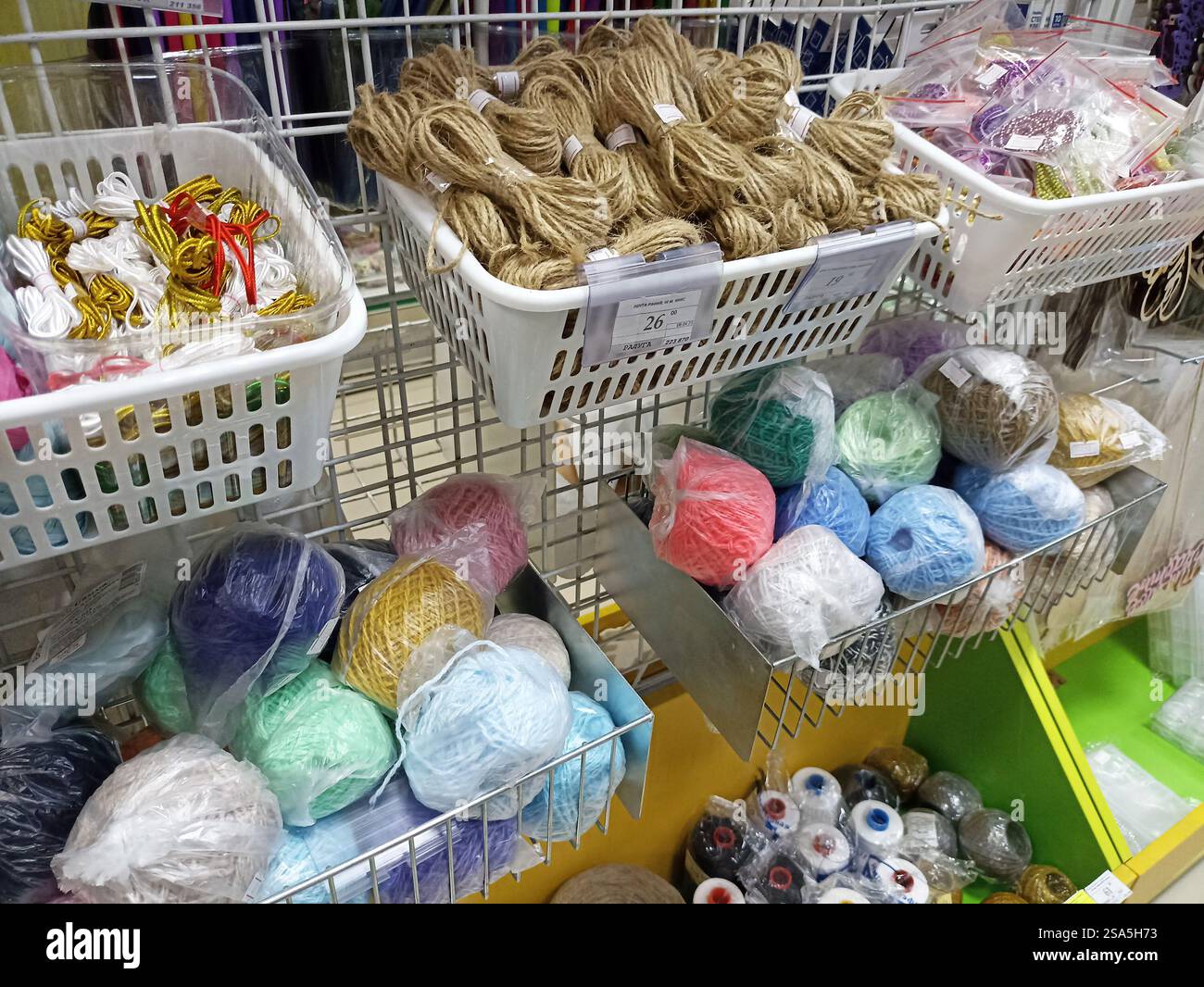 Colorful yarn and twine display in craft store Stock Photo - Alamy