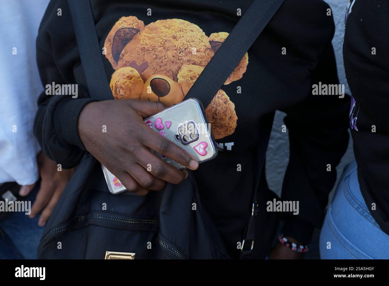 A Haitian migrant waits outside the Mexican Commission for Refugee Aid ...