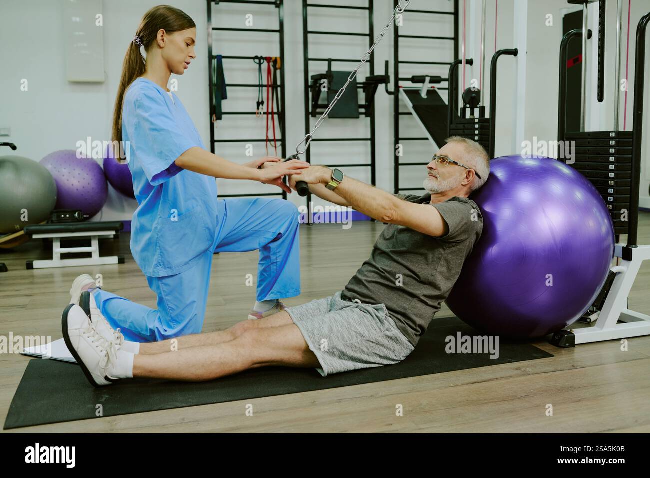 Elderly female doing rehab hi-res stock photography and images - Alamy
