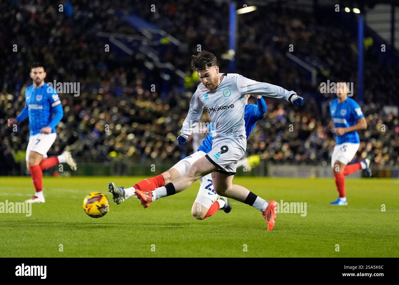 Millwall's Aaron Connolly crosses the ball during the Sky Bet Championship match at Fratton Park ...