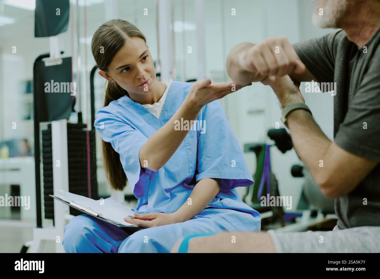 Medium close up of female doctor holding paper folder on knees ...