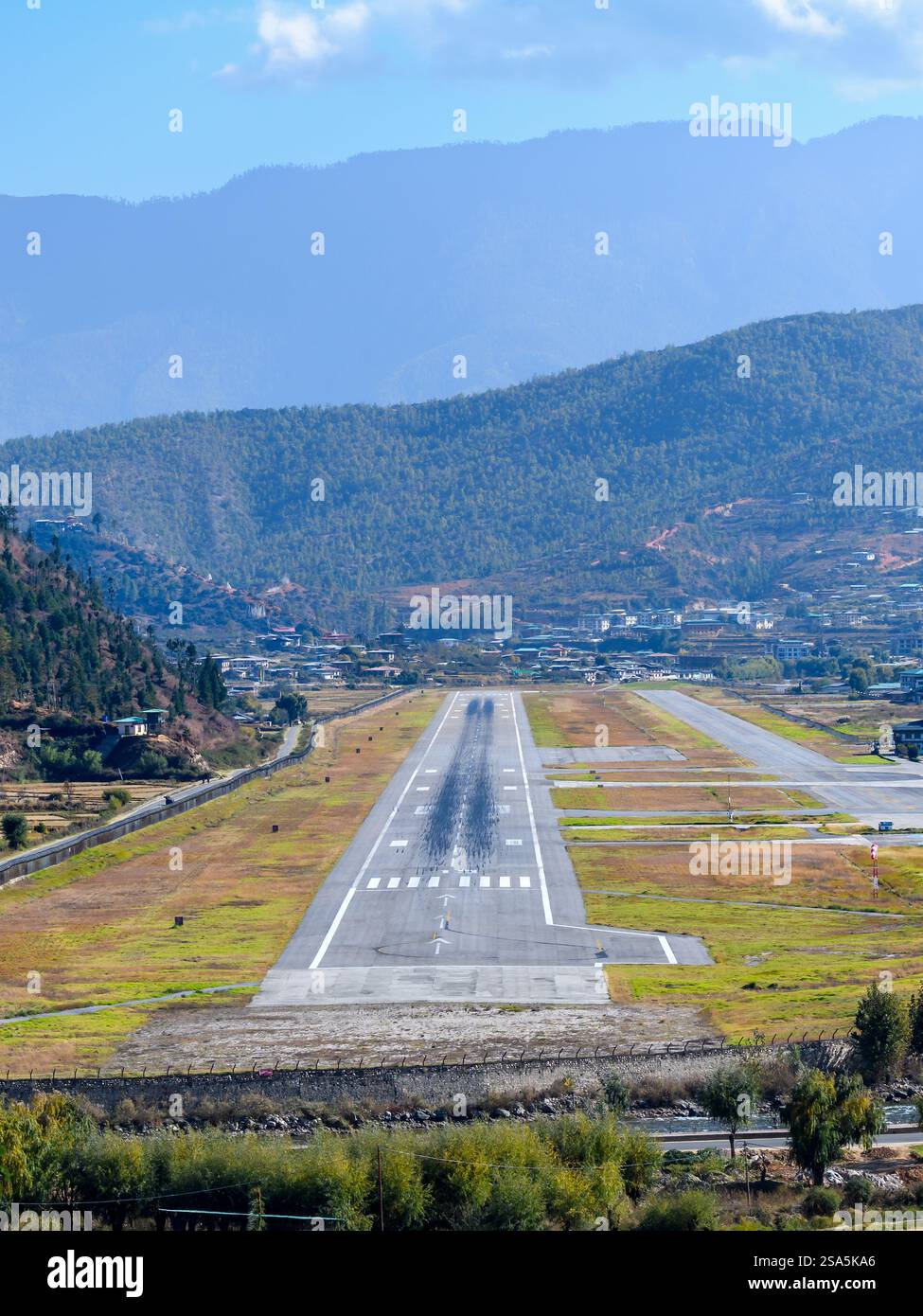 Paro International Airport runway in Paro Valley, Bhutan. Challenging ...