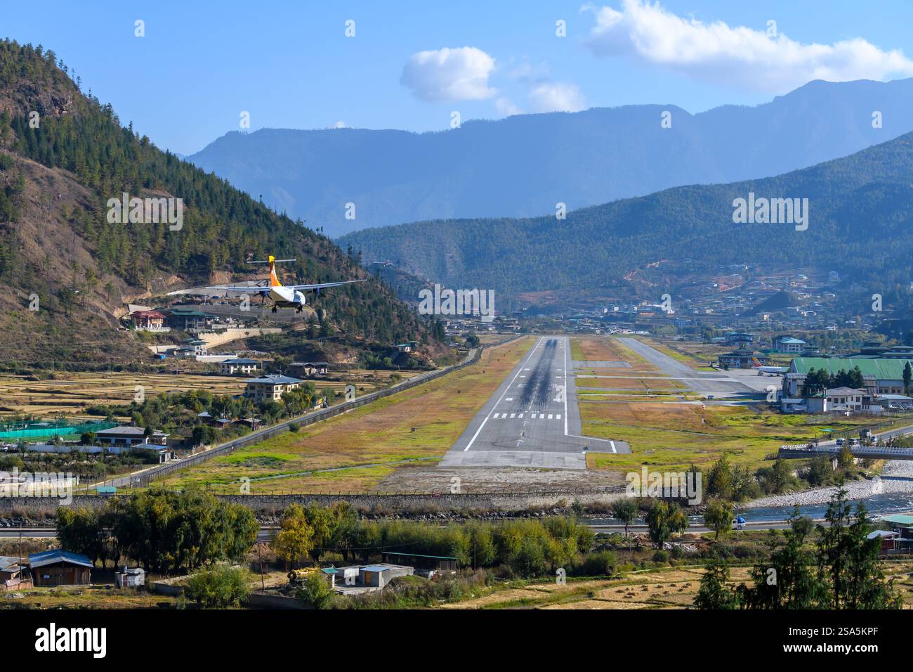Aircraft landing at Paro International Airport runway in Paro Valley ...