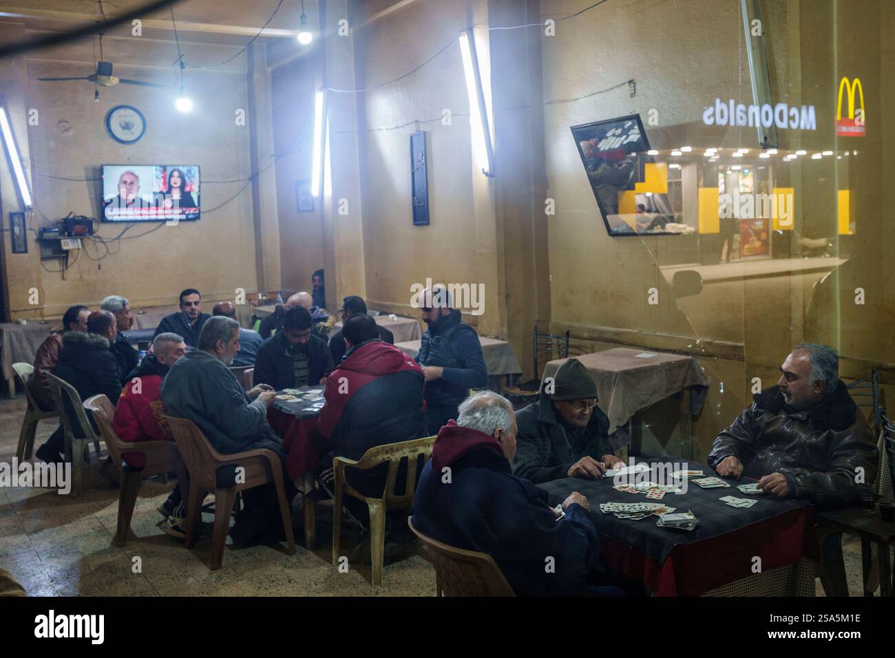 Men drink tea at a local coffe shop in the northern Syrian city of ...