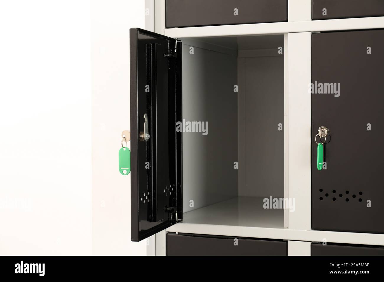 Modern lockers with keys on white background, closeup Stock Photo - Alamy