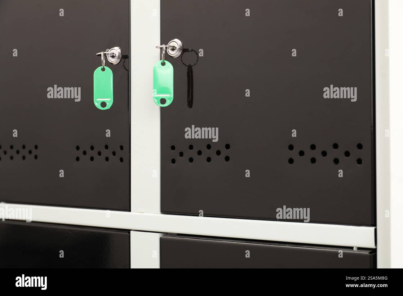 Modern lockers with bright keys, closeup view Stock Photo - Alamy