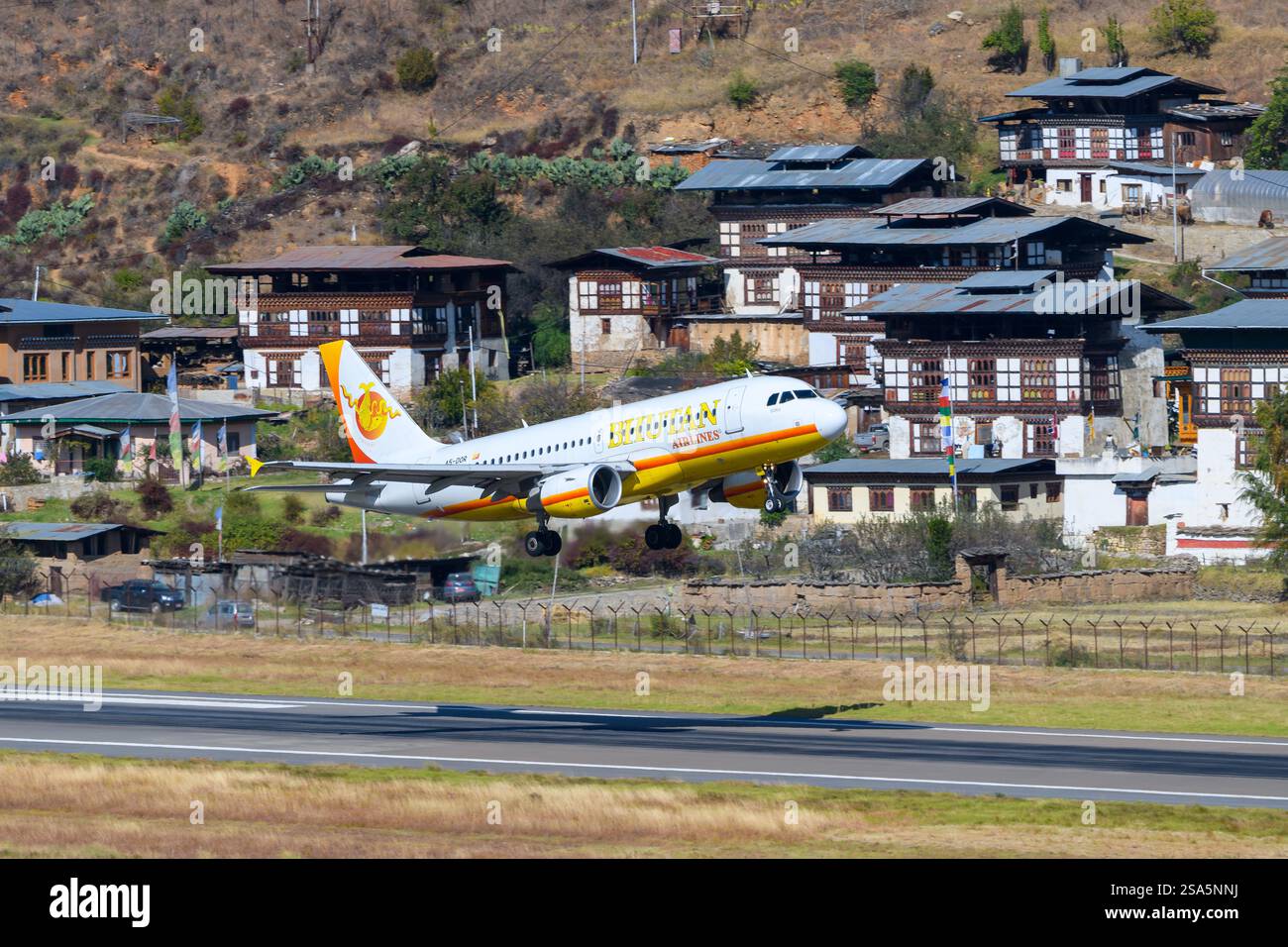 Bhutan Airlines Airbus A319 aircraft taking off from Paro Airport in Bhutan. Airline Bhutan ...