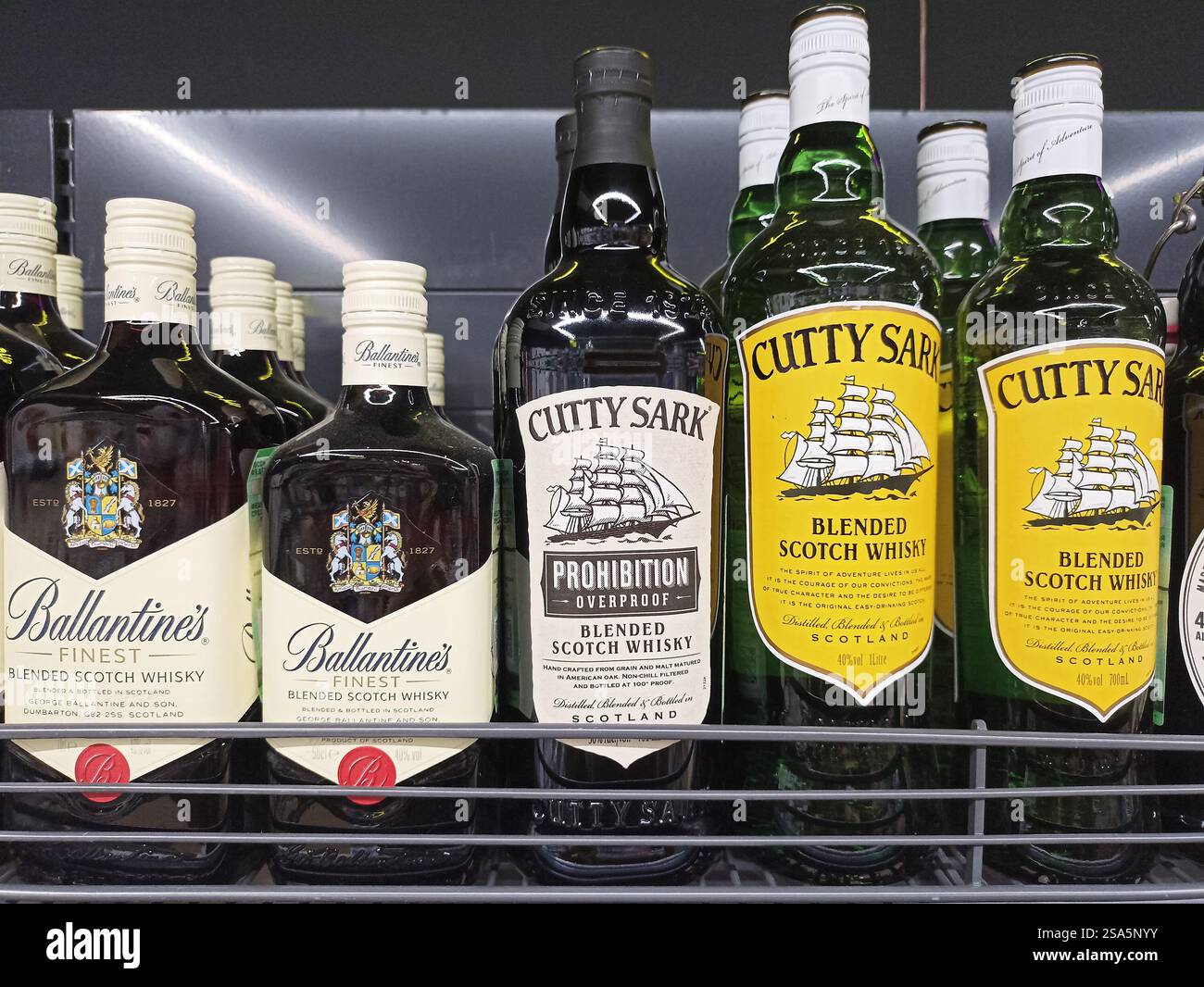 Variety of scotch whisky bottles on display in liquor store shelf Stock ...