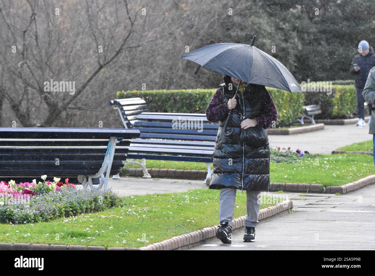 Santander, Cantabria, Spain, January 28, 2025, People walk in bad ...