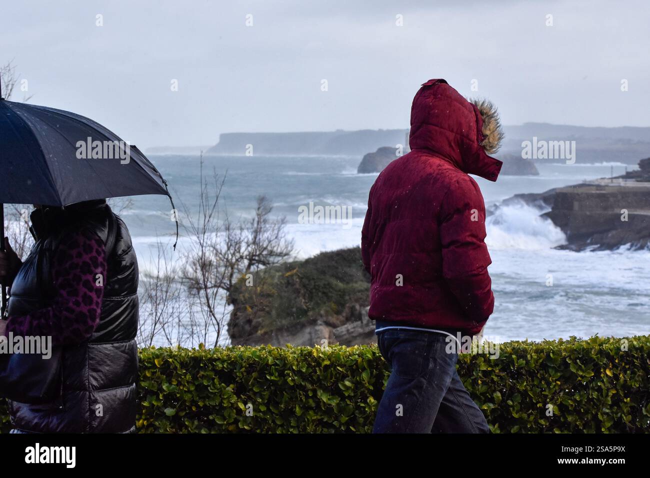 Santander, Cantabria, Spain, January 28, 2025, People walk in bad ...