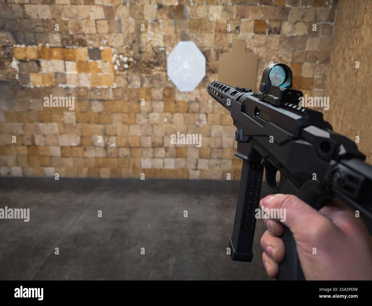 Shooting from a modern 9mm caliber carbine with a holographic sight at ...