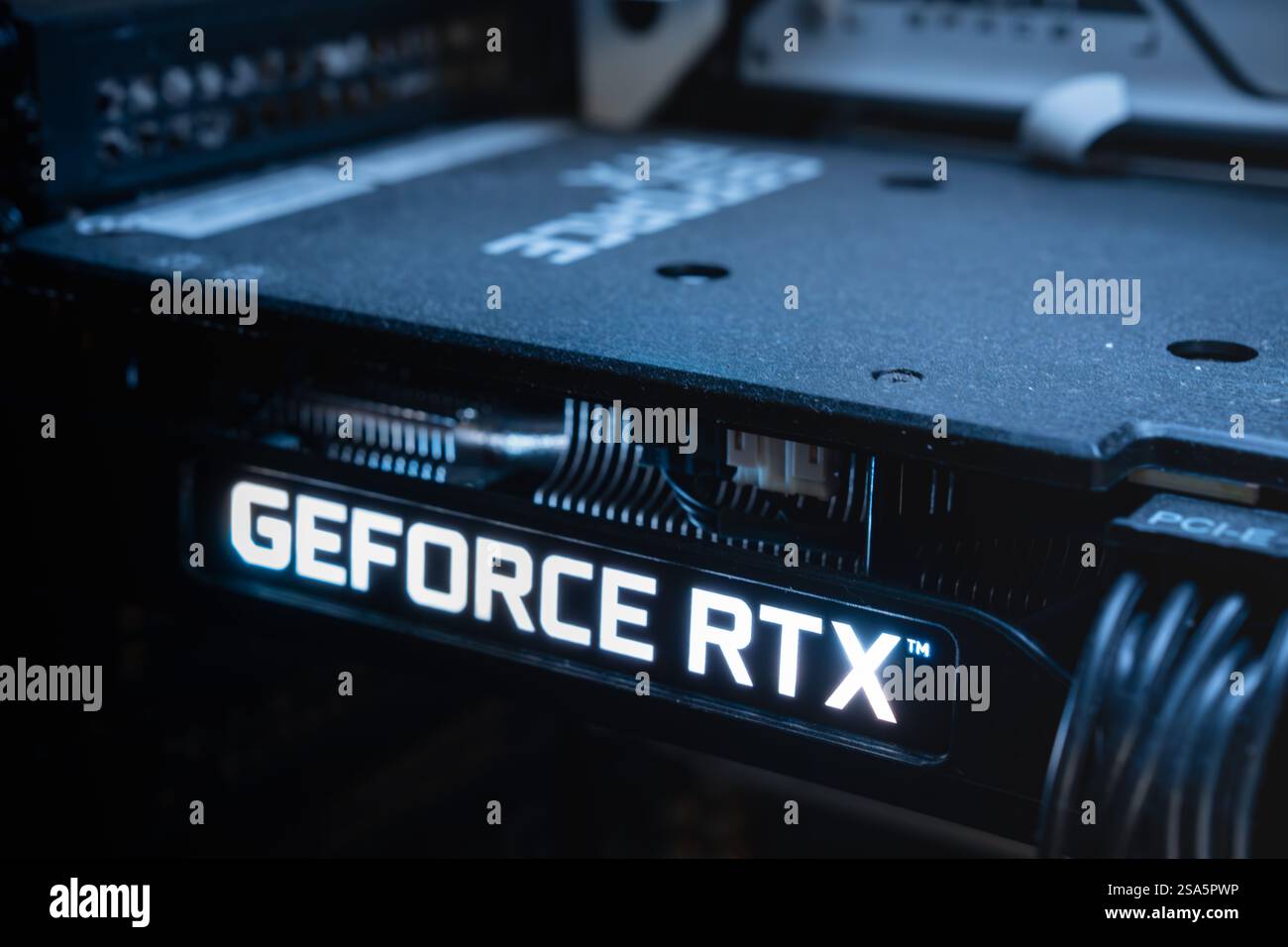 Powerful GeForce RTX graphics card illuminated in a sleek gaming setup ...