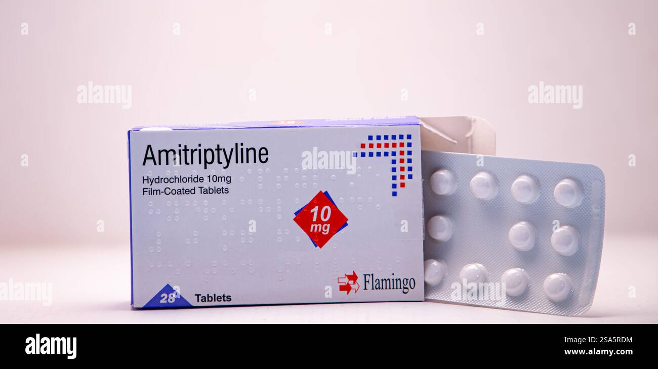A box and blister pack of Amitriptyline 10 mg film-coated tablets on a light background Stock ...