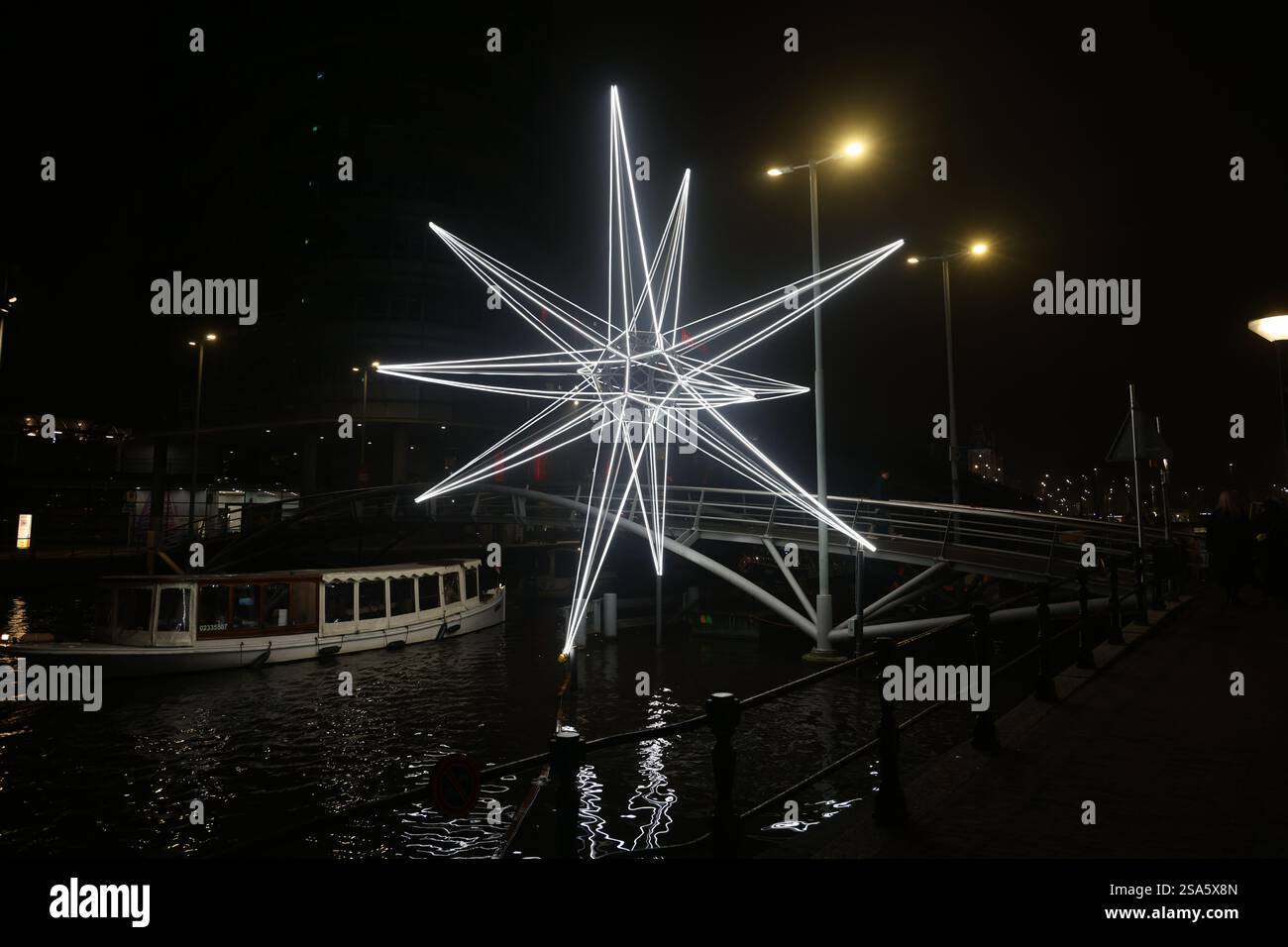 Artwork Polaris by Jun Ong at the Amsterdam Light Festival 2024-2025, along a canal in Amsterdam ...