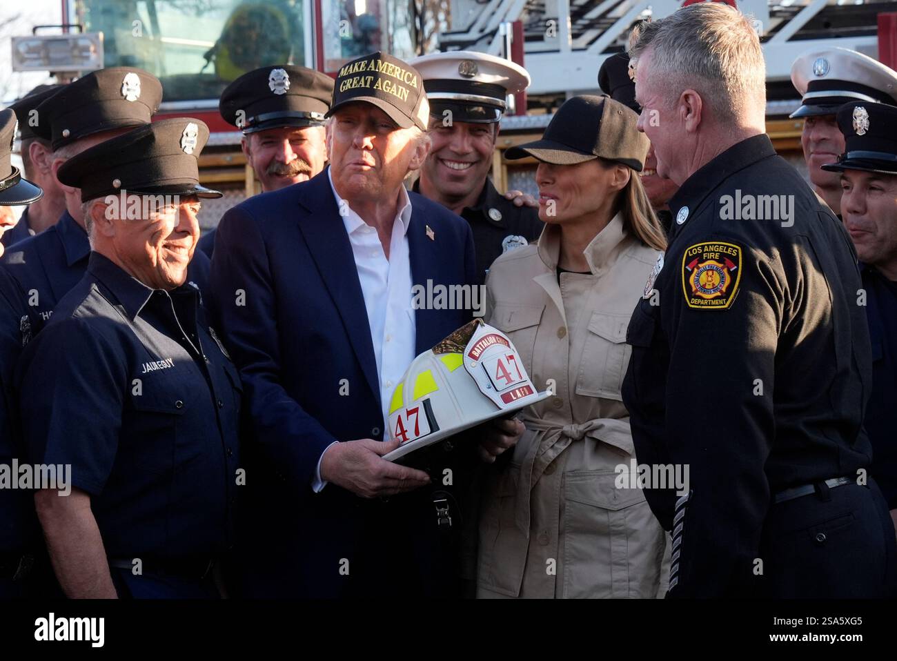 FILE - President Donald Trump and first lady Melania Trump talk with ...