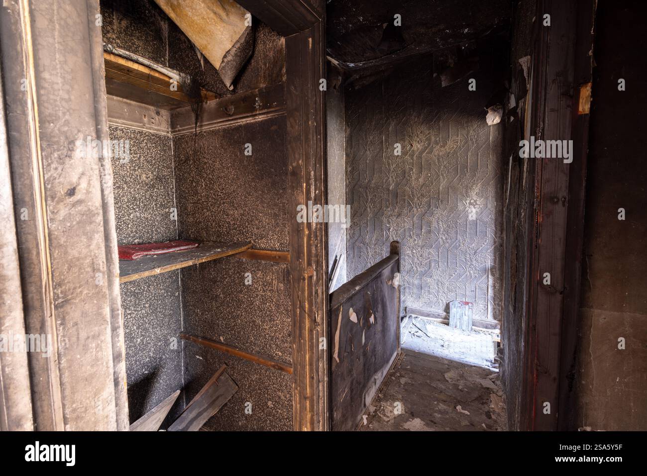 Photo of an extremely run down property that has had a massive fire ...