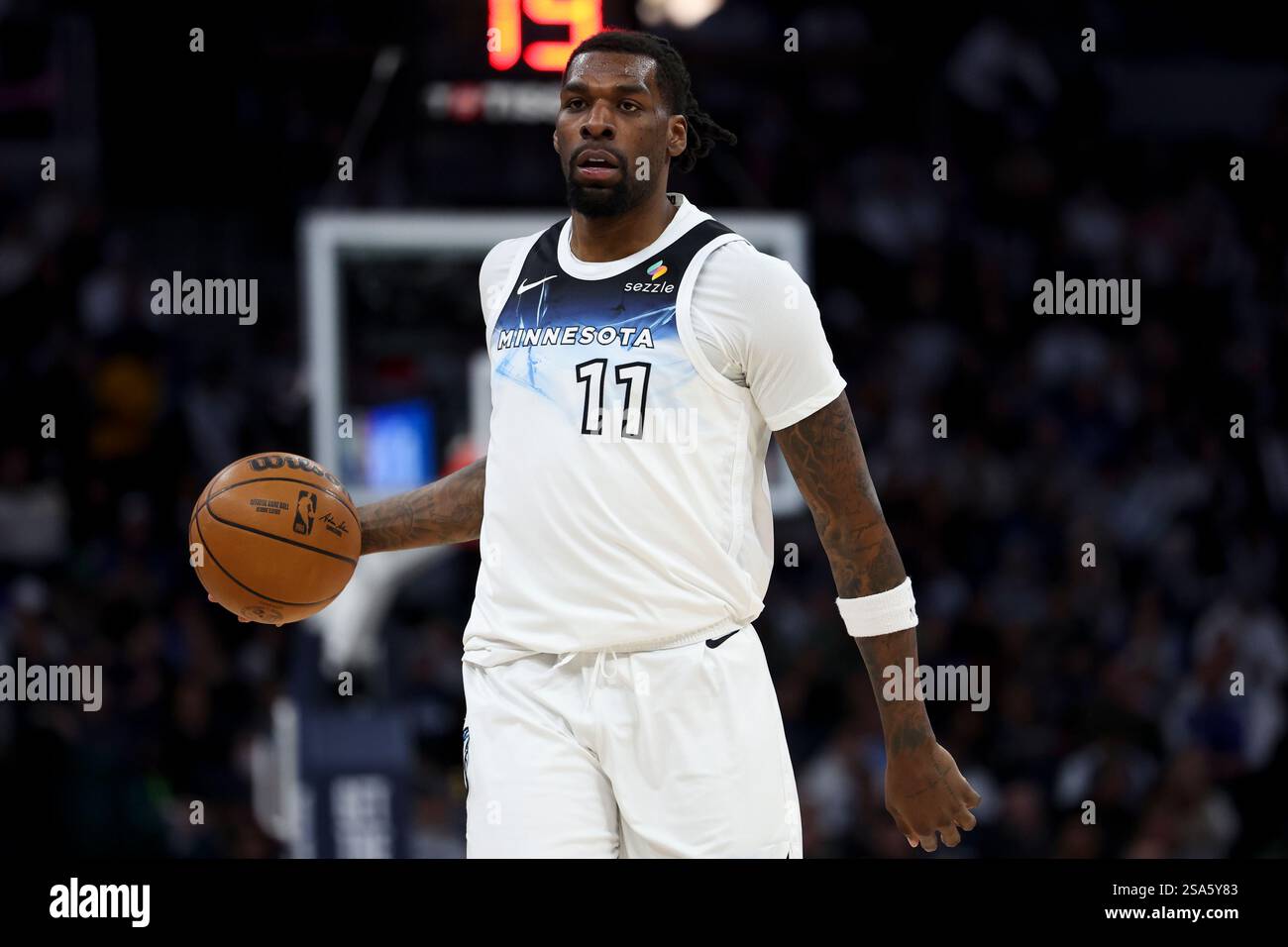Minnesota Timberwolves center Naz Reid (11) dribbles up the court ...