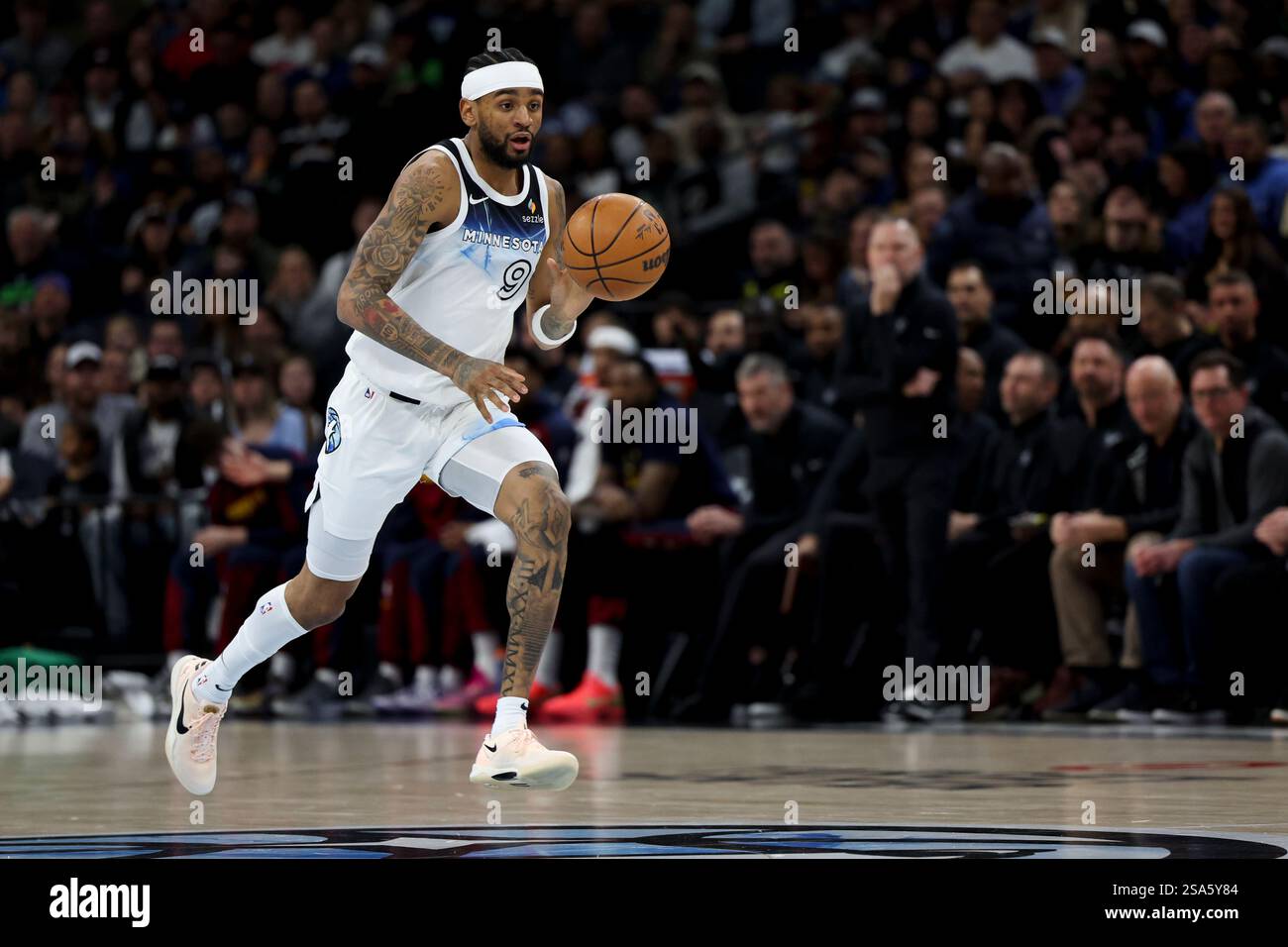Minnesota Timberwolves guard Nickeil Alexander-Walker (9) dribbles up ...