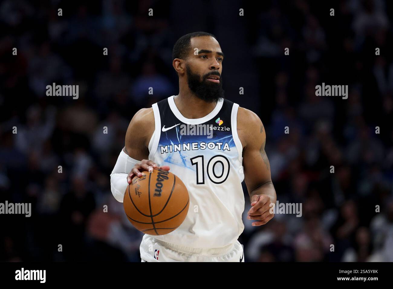 Minnesota Timberwolves guard Mike Conley (10) dribbles up the court ...