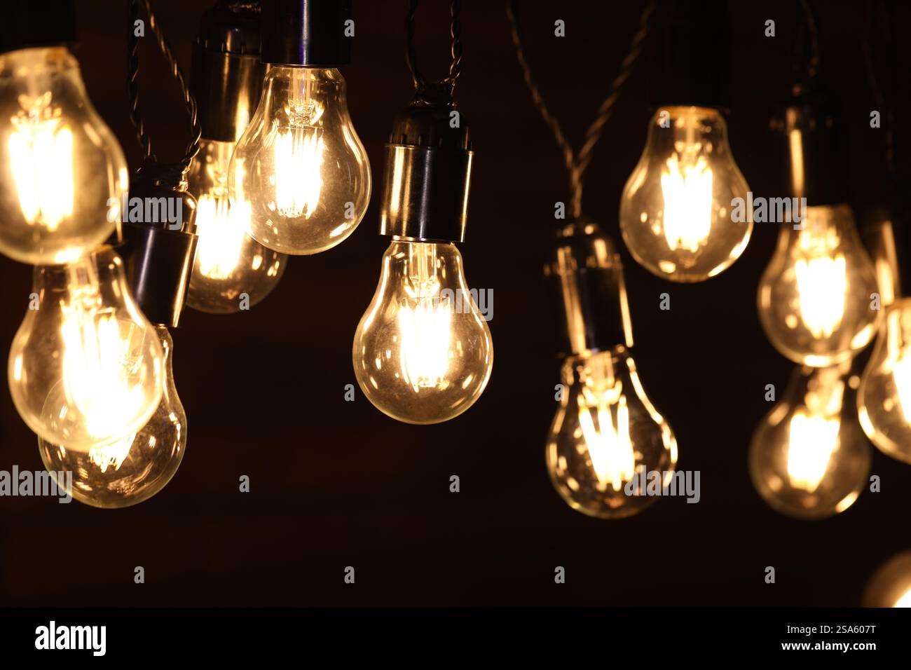 Glowing light bulbs on black hi-res stock photography and images - Alamy