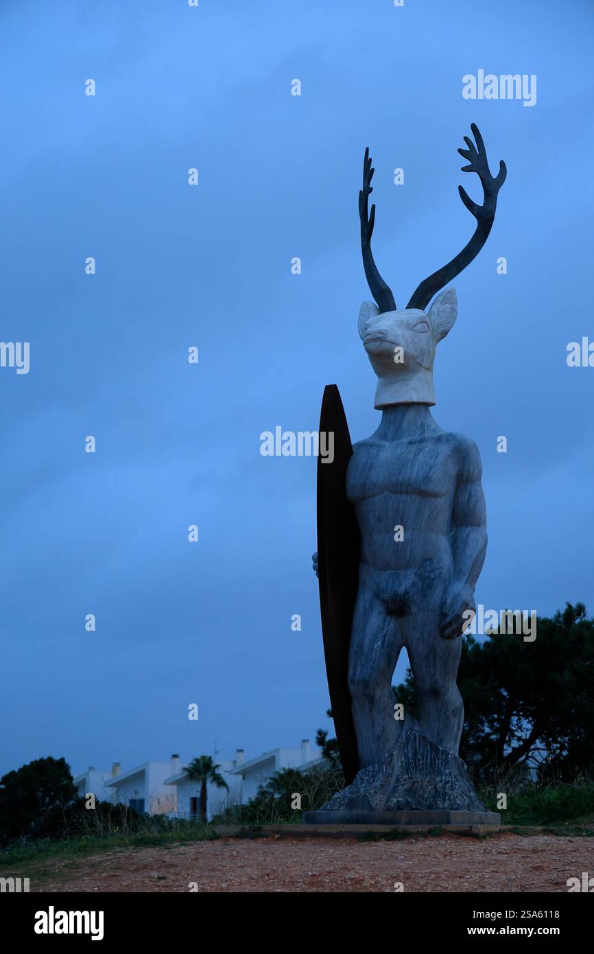 The statue of "Veado" aka Surf Monument, a deer-headed surfer holding a ...