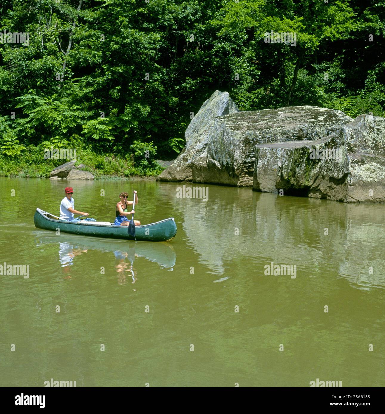 Two canoists enjoy the day at Long Pool State Park on the Big Piney ...