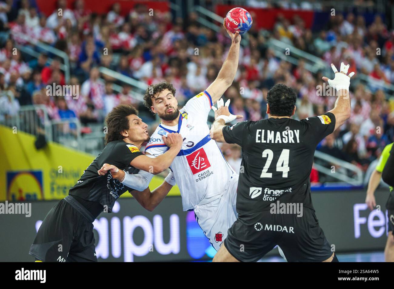 Zagreb, Croatia. 28th Jan, 2025. Nedim Remili of France is challenged ...