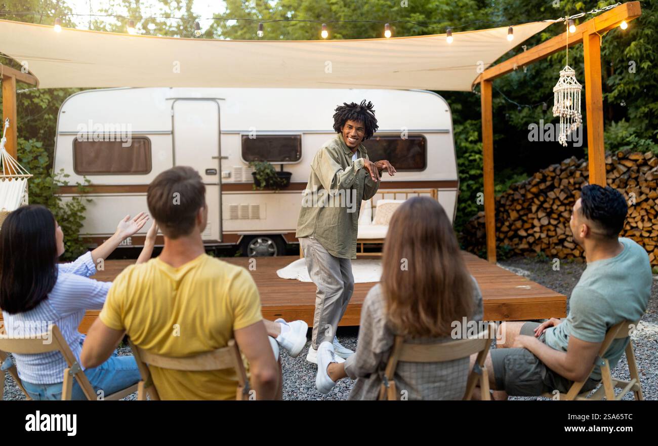 Young multiracial friends playing guess who game, laughing, having fun ...