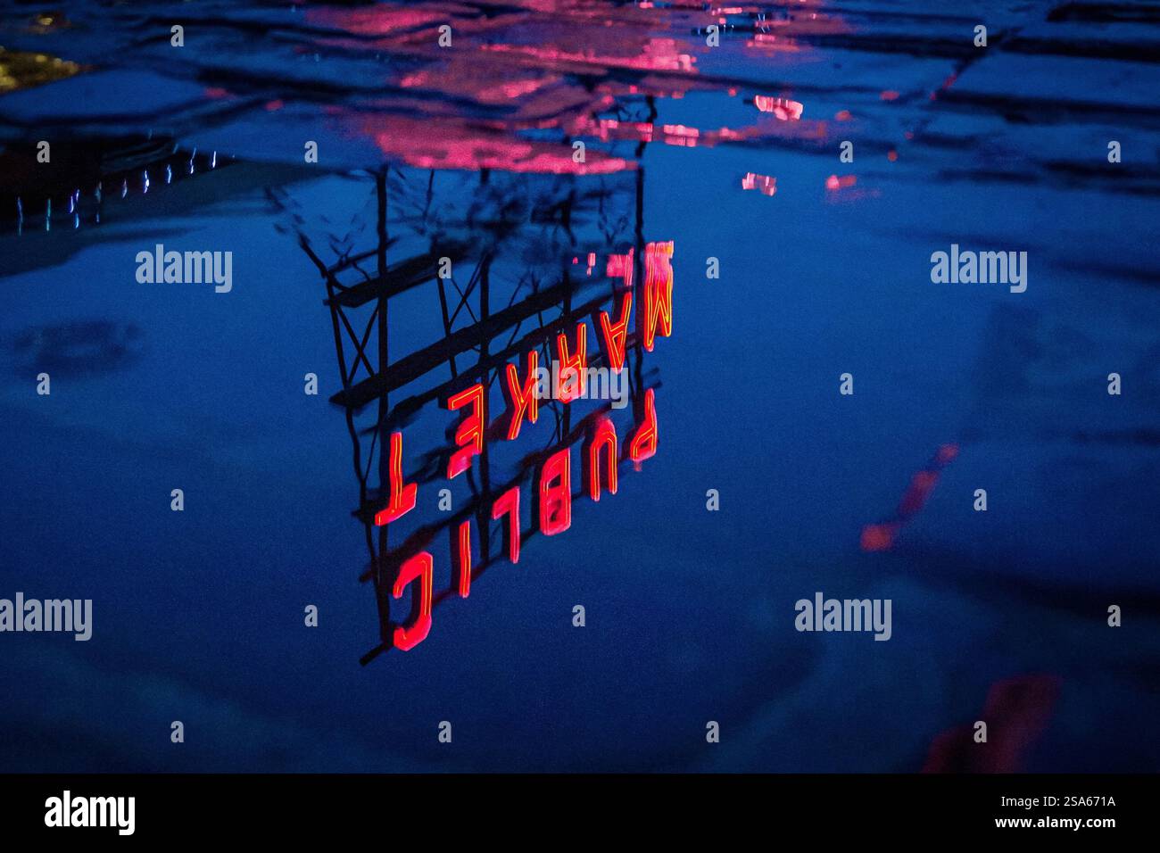 A vibrant reflection of the iconic Pike Place Market neon sign captured ...