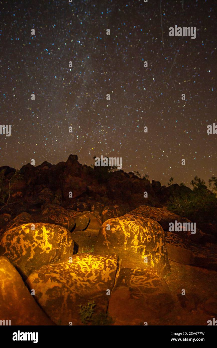 USA, Arizona, Painted Rock Petroglyph Site. Illuminated rock ...
