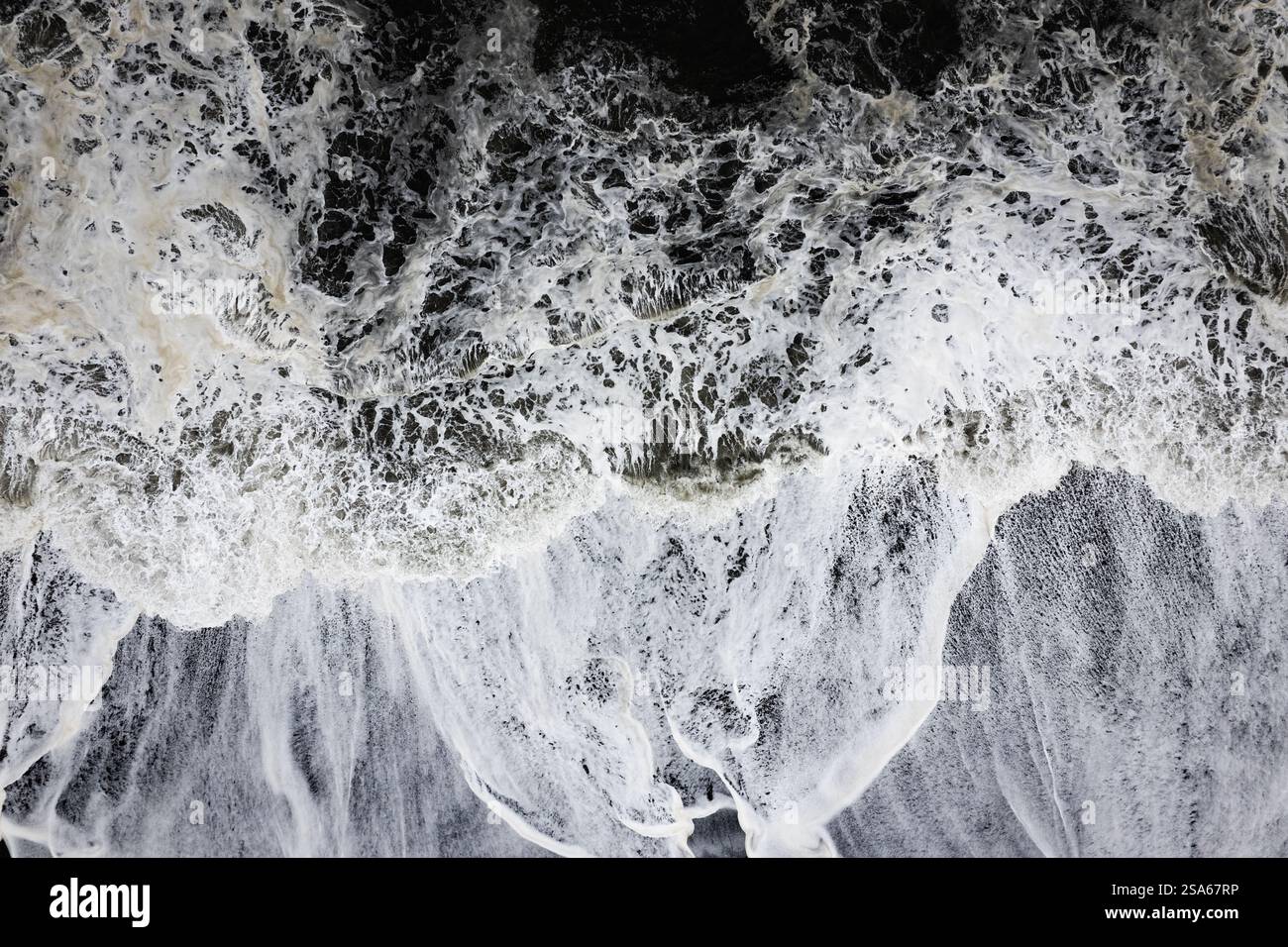 Aerial drone view of epic ocean waves crashing on the shoreline black ...